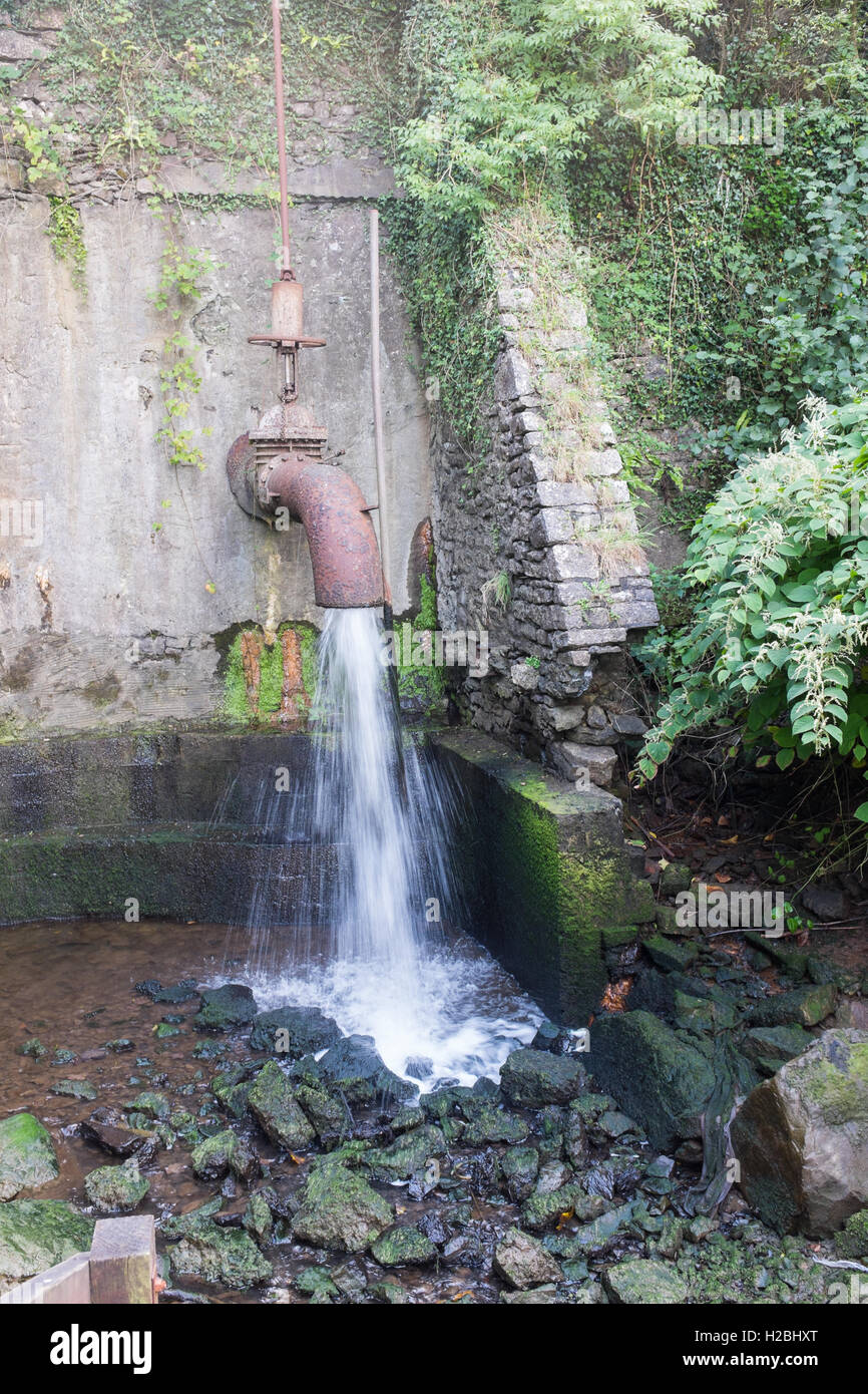 Water gushing out of a large tap or pipe Stock Photo - Alamy