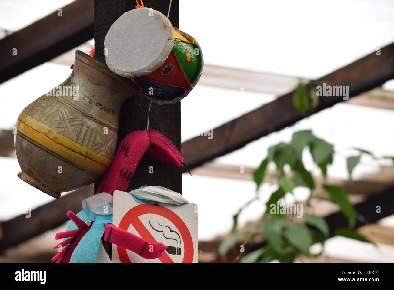 Traditional Guatemalan objects hanging on the column of a restaurant ...
