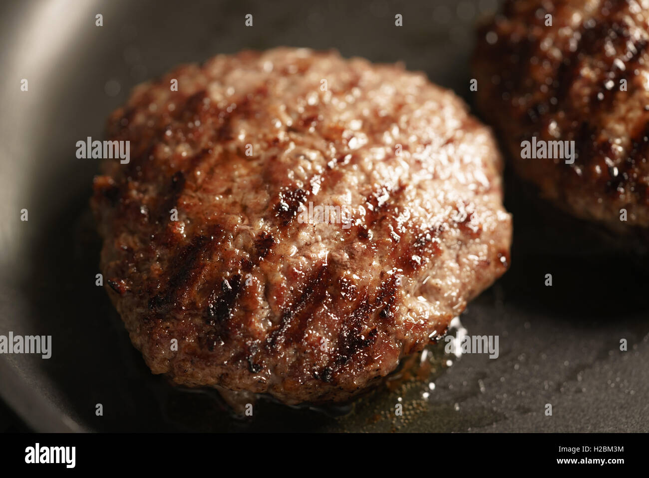 beef cutlets rest on frying pan Stock Photo - Alamy