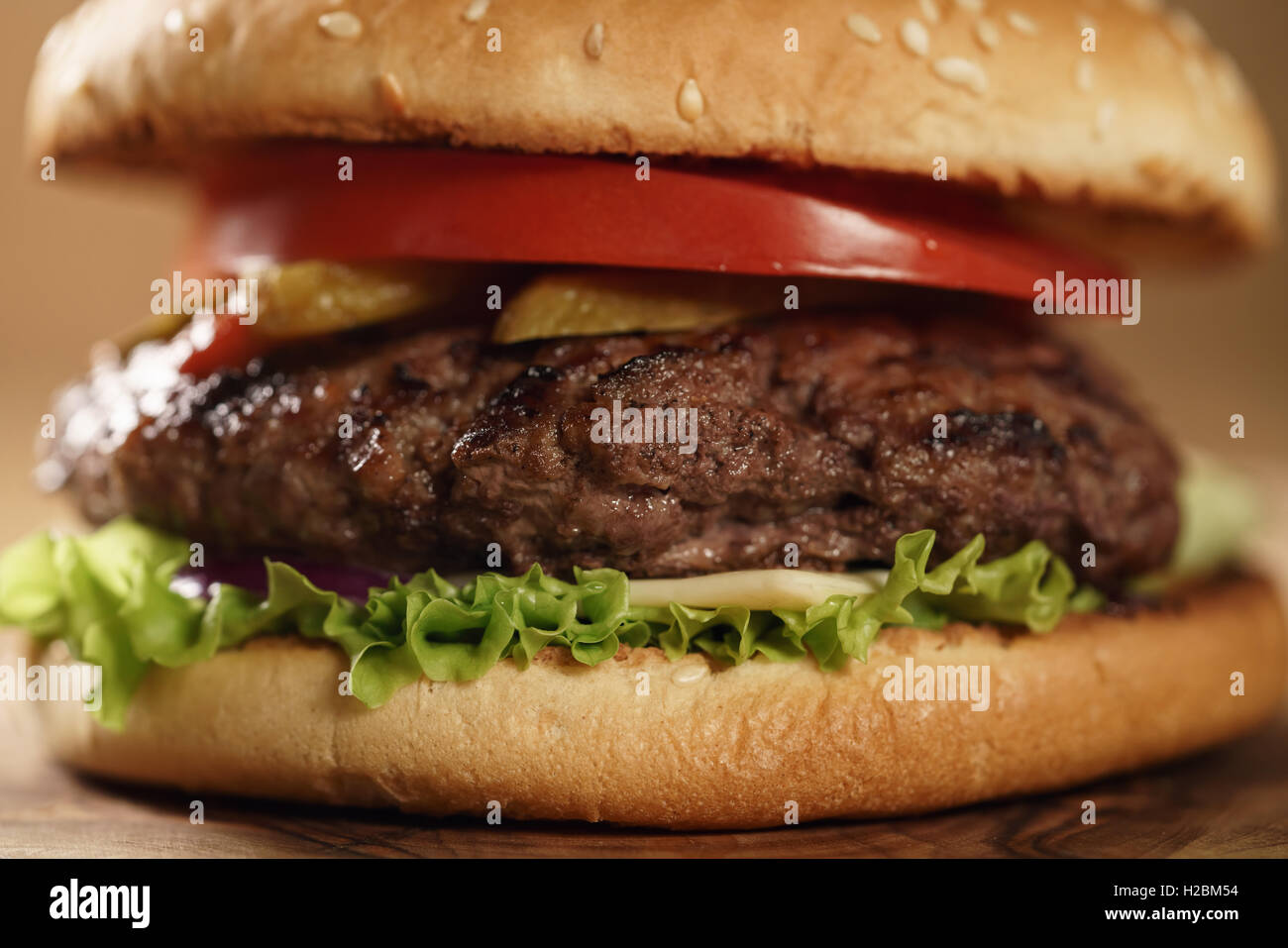 closeup fresh homemade burger with marble beef, cheese and vegetables ...
