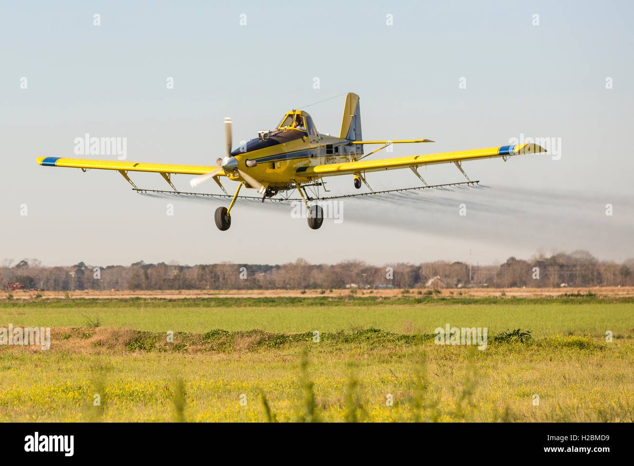 An aerial crop duster sprays a field in rural Eunice, Louisiana Stock ...