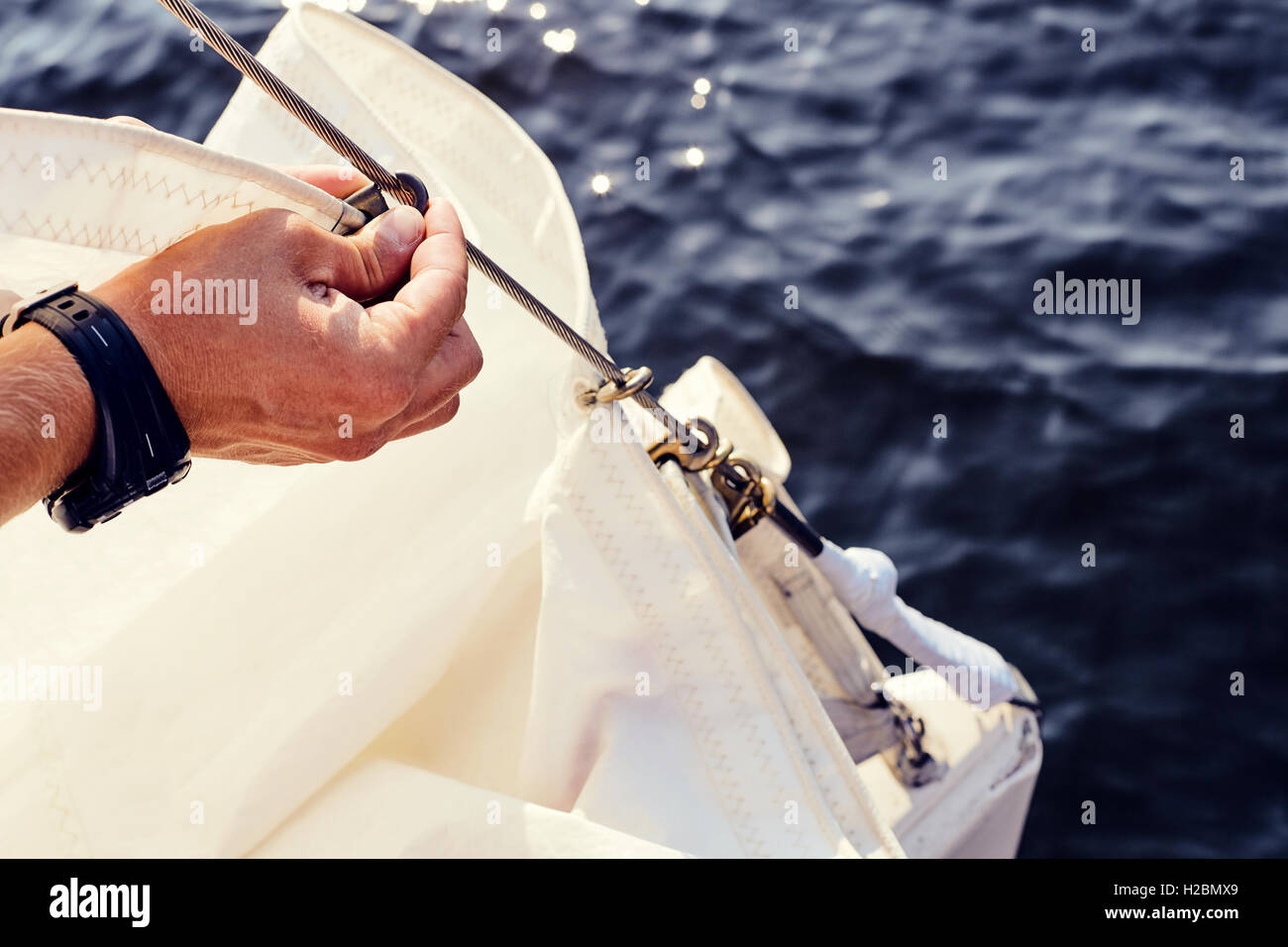 Preparing before lifting staysail sails Stock Photo - Alamy
