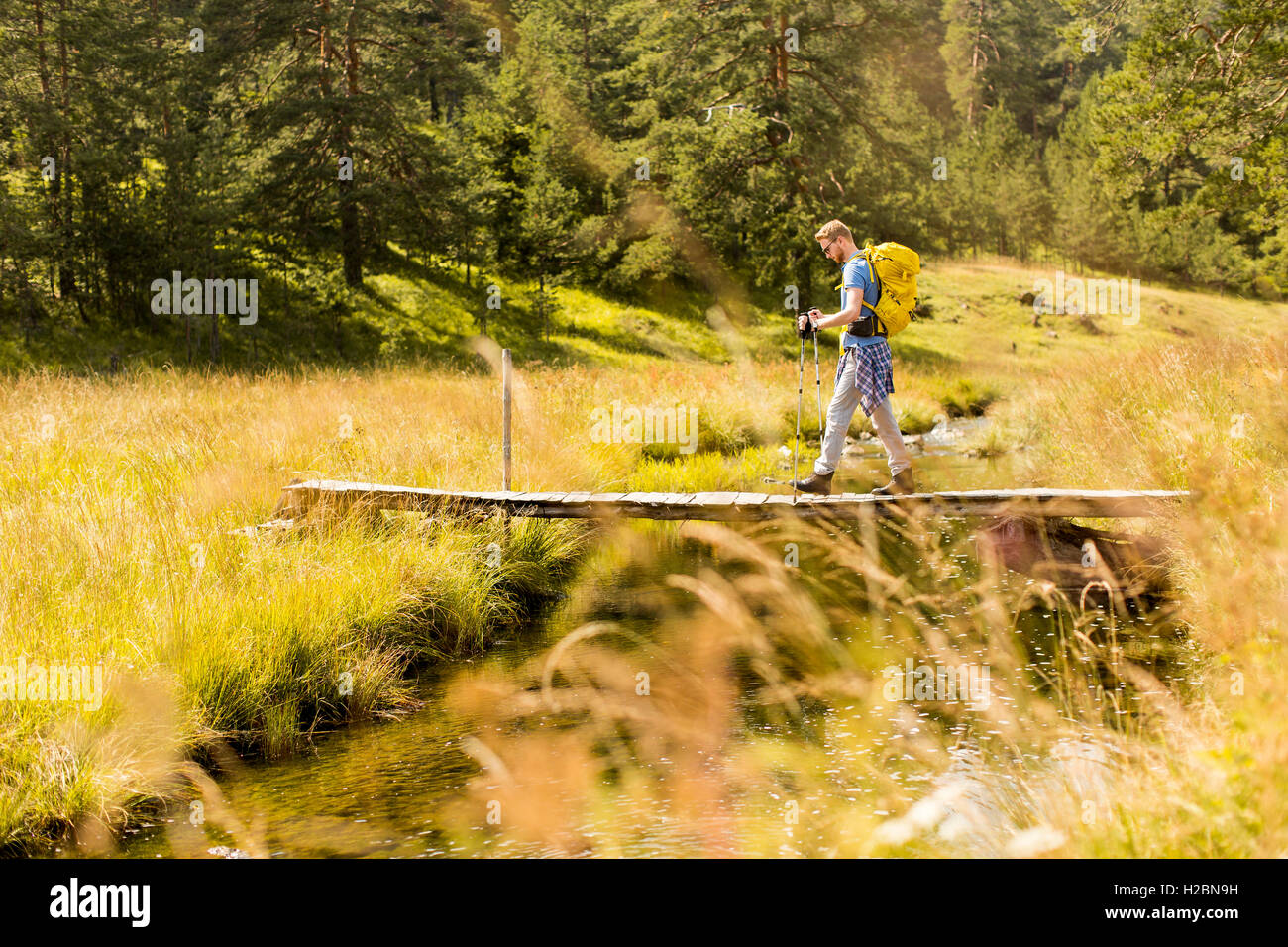 Young man crosses mountain hi-res stock photography and images - Alamy