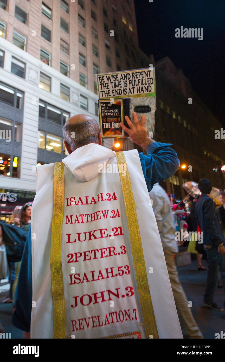 Christian street preacher preaches to passing pedestrians on Times ...