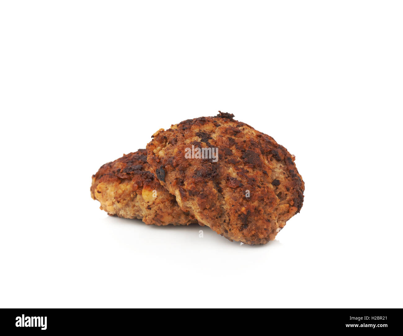 Couple of small hand made cutlets isolated over white background Stock ...