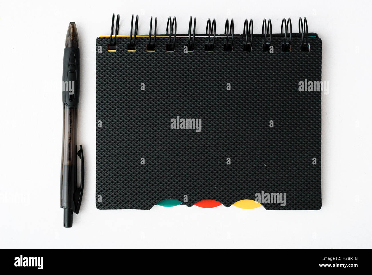 notepad with pen isolated Stock Photo - Alamy
