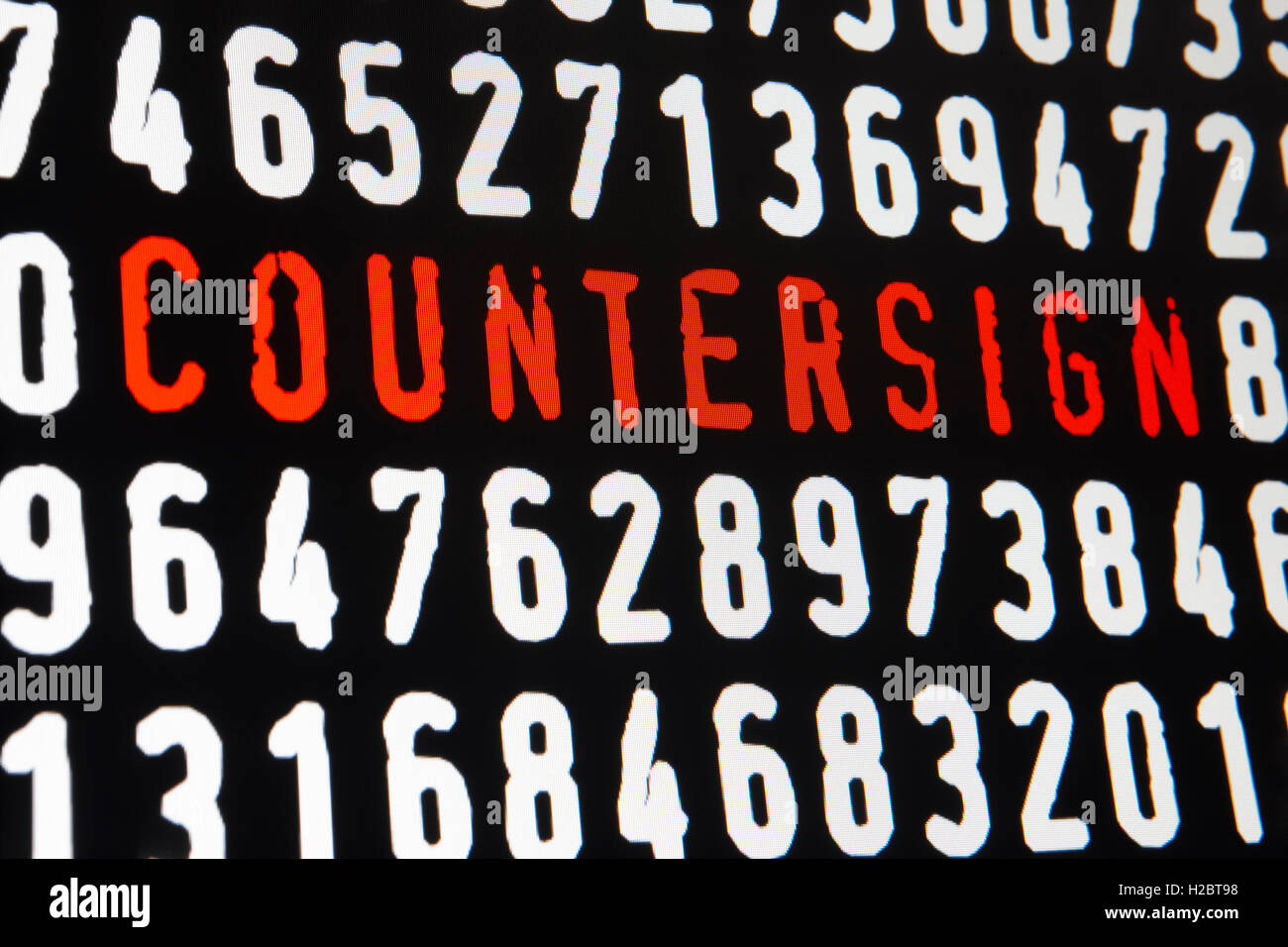 Computer screen with countersign text and numbers on black background ...