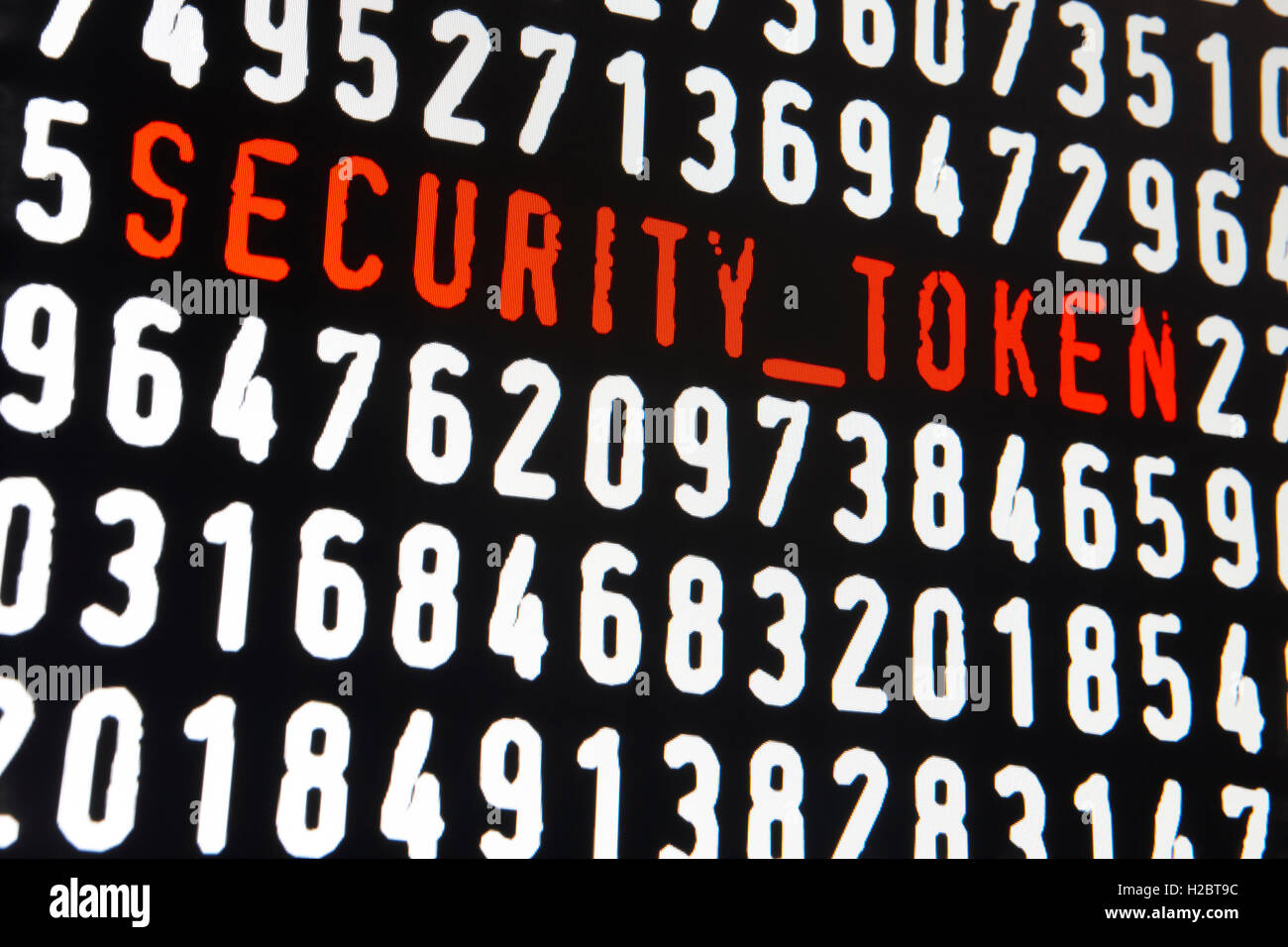 Computer screen with security token text on black background ...