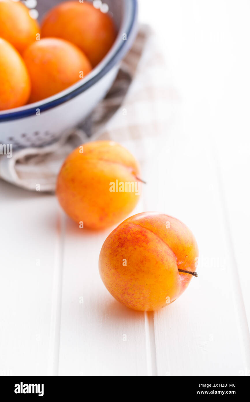 Ripe yellow plums on kitchen table Stock Photo - Alamy