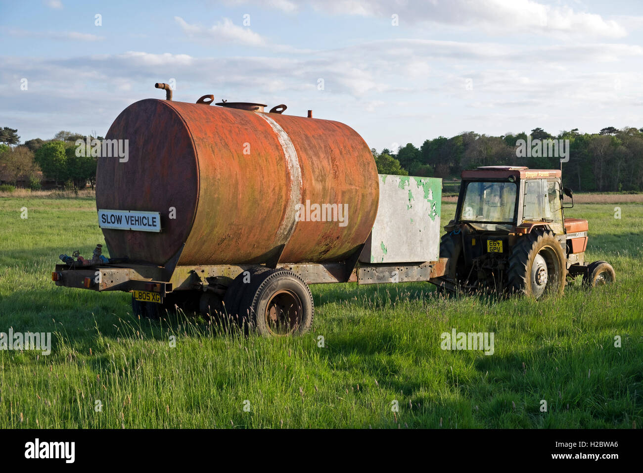 Tractor and water tanker for livestock Stock Photo - Alamy