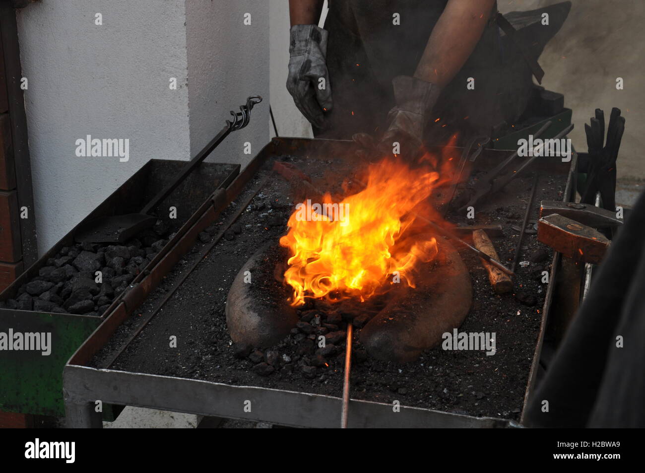 Forging iron in the forge, blacksmith, fire, hearth, craft, history ...