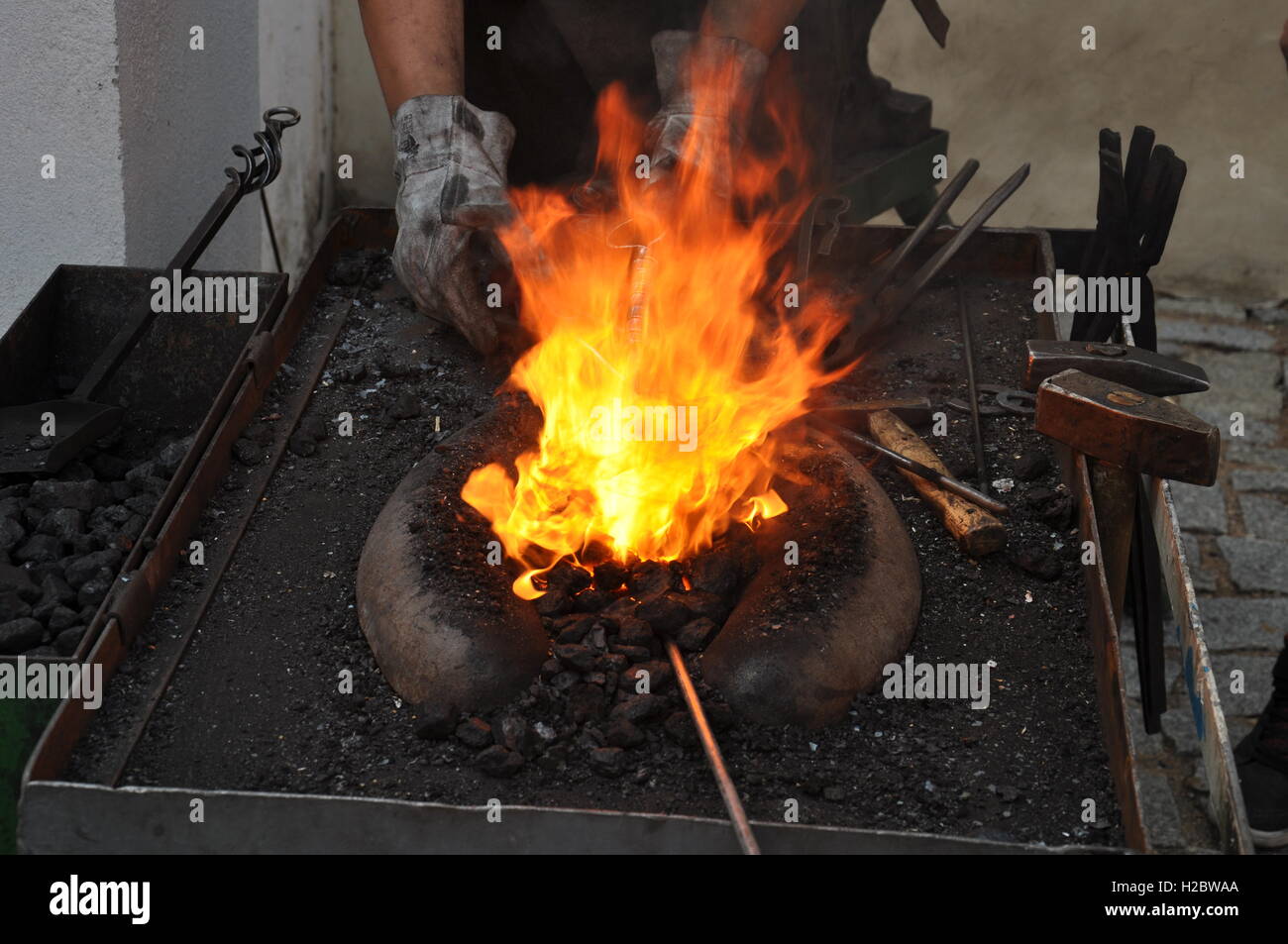 Forging iron in the forge, blacksmith, fire, hearth, craft, history ...