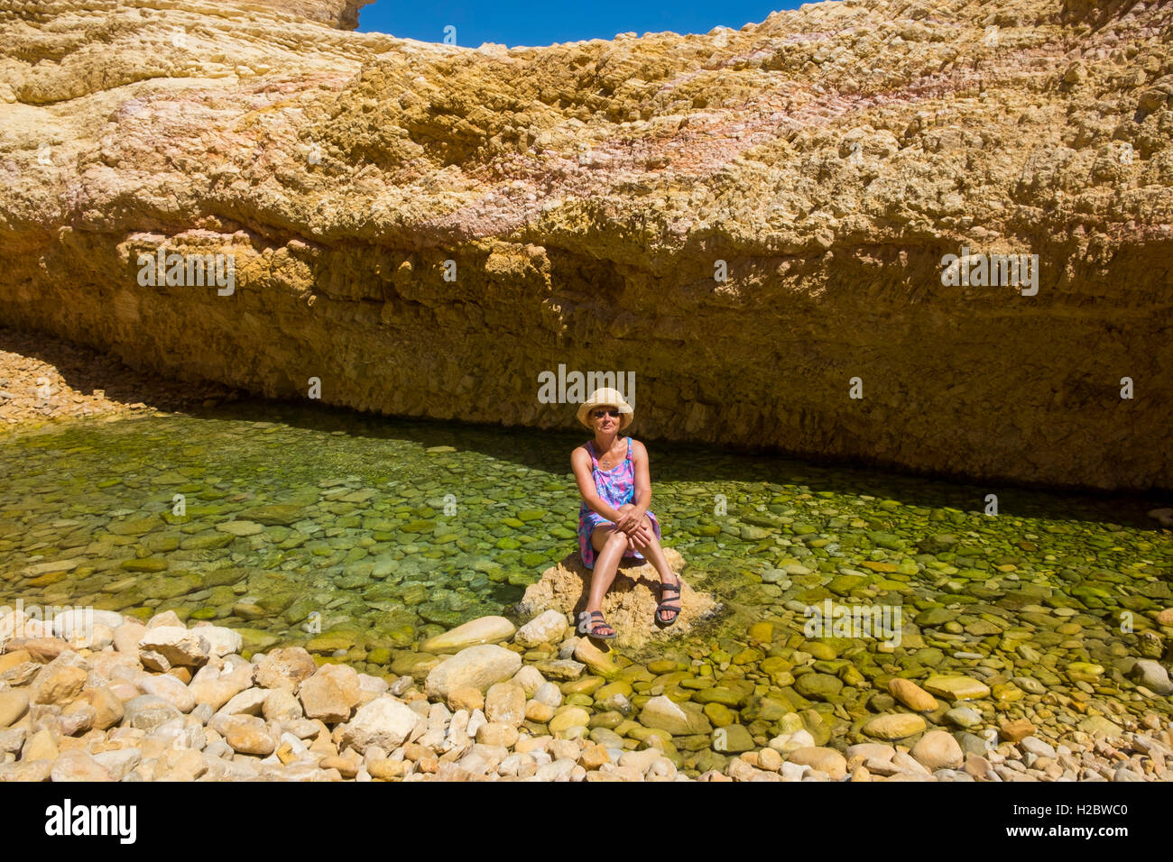 Woman on rock hi-res stock photography and images - Alamy