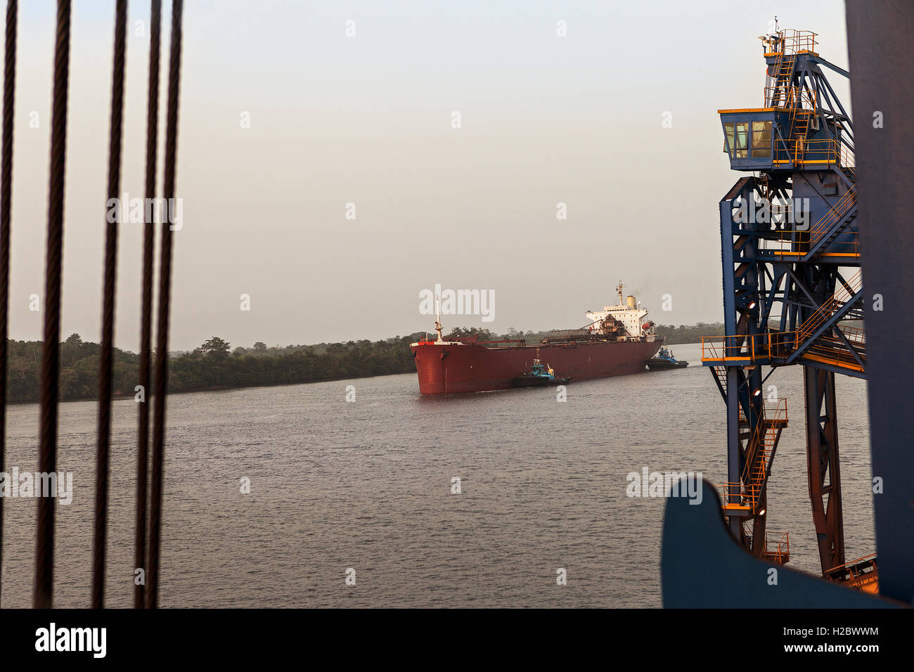 Marine and port operations from jetty. Two tugs moving and turning ...