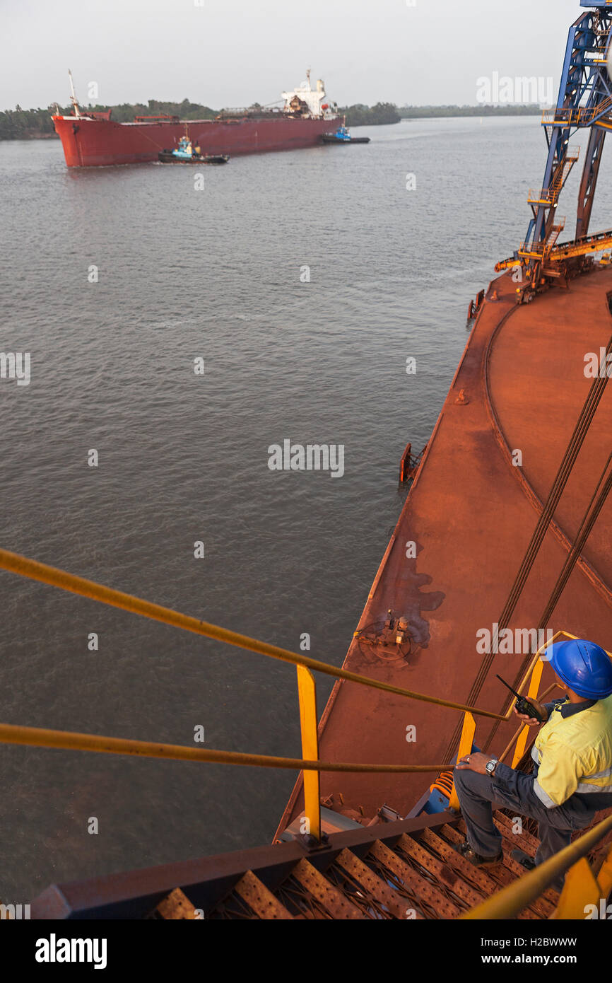 Marine and port operations from jetty. Two tugs moving and turning ...