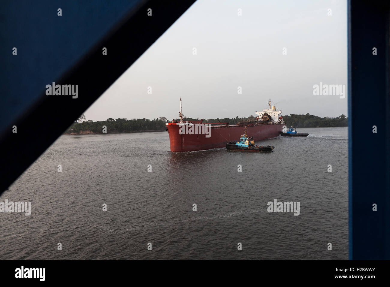 Marine and port operations from jetty. Two tugs moving and turning ...