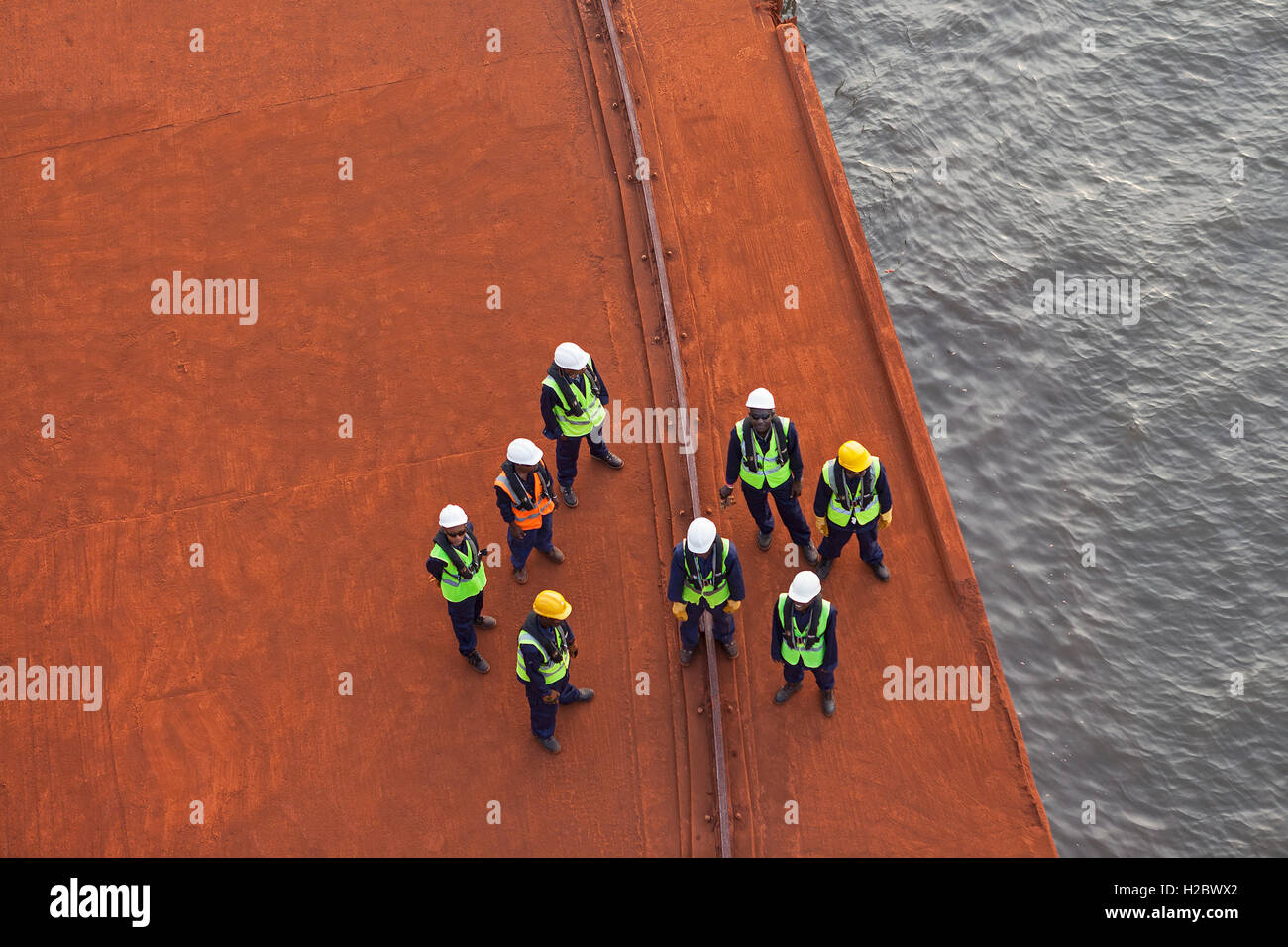 Port operations on jetty. Marine workers and stevedores assembling on ...