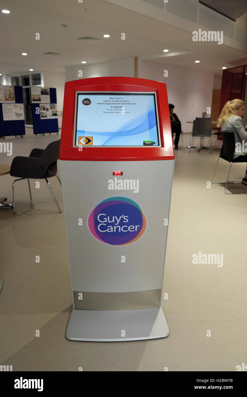 Digital NHS Self Check-In kiosk in the reception area at Guy's Hospital ...
