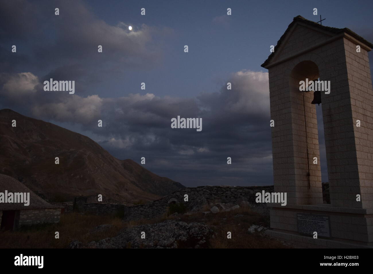 A bell tower of an old church under the moonlight Stock Photo - Alamy