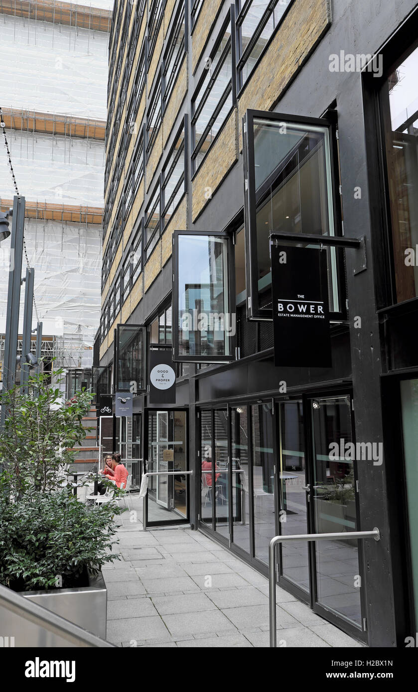 People outside the refurbished 1960s office building at the Bower 211 ...