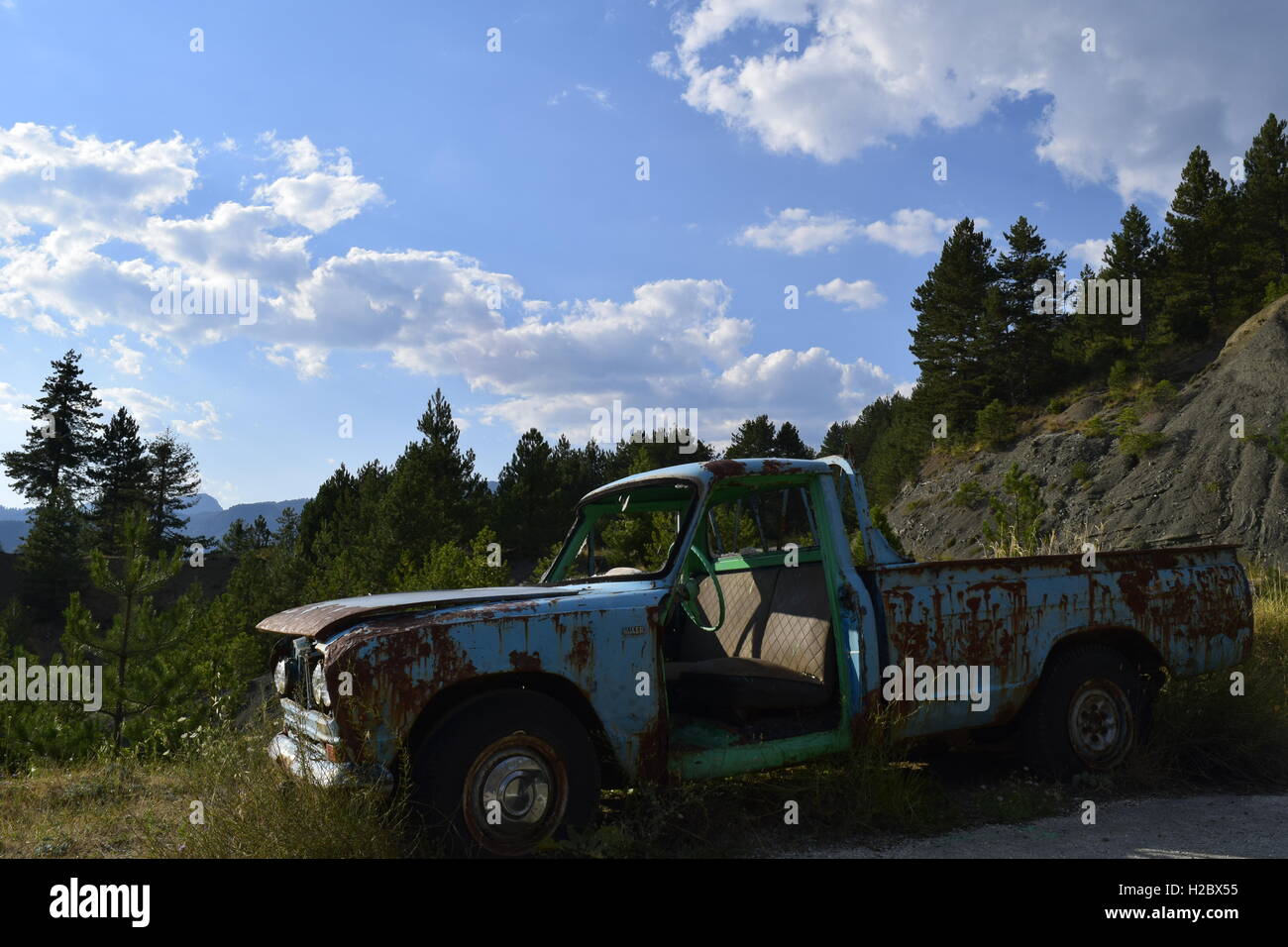 An old ruined car parked at the mountains Stock Photo - Alamy