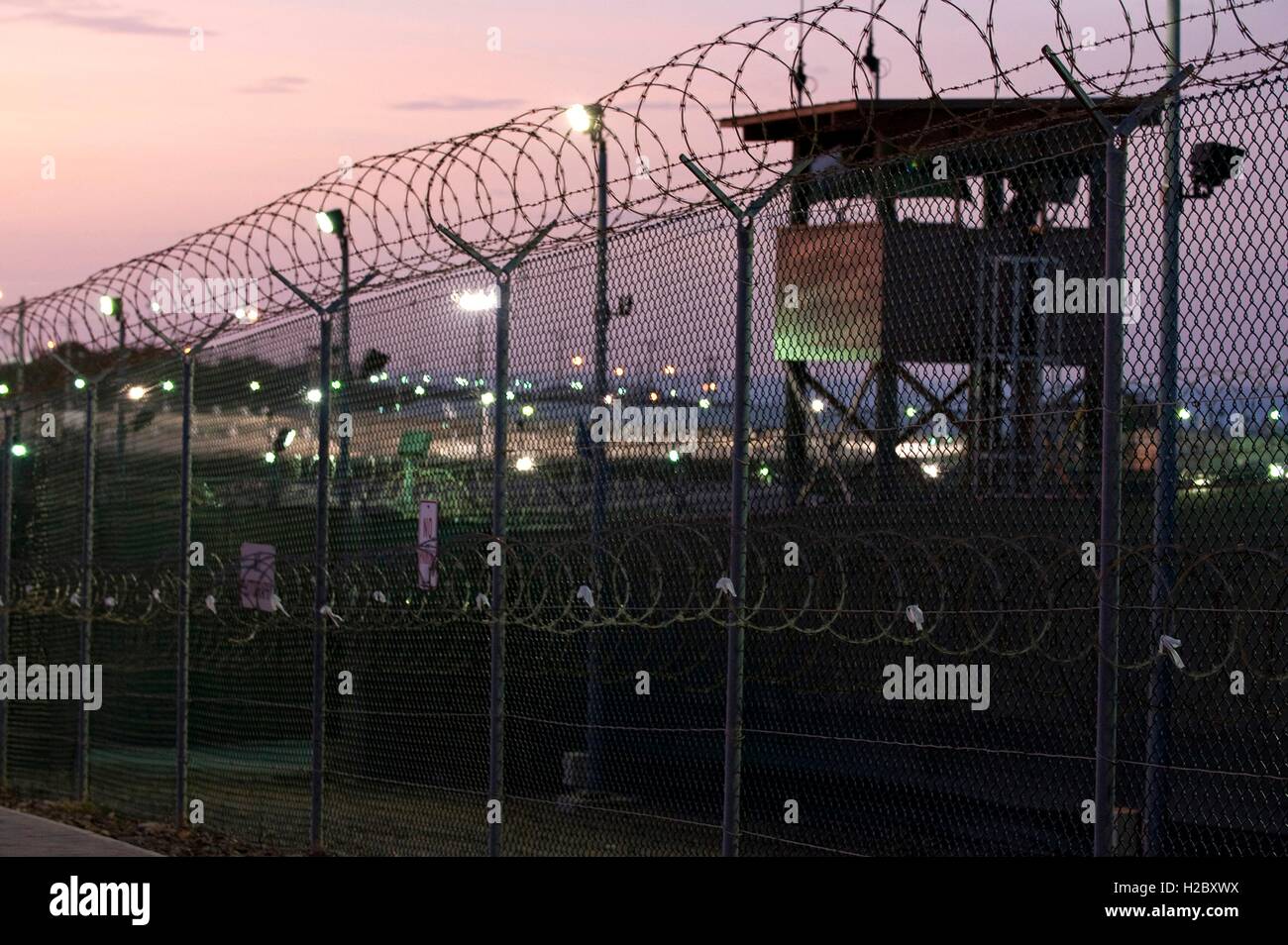 Security guards patrol the prison grounds from guard towers at Joint ...