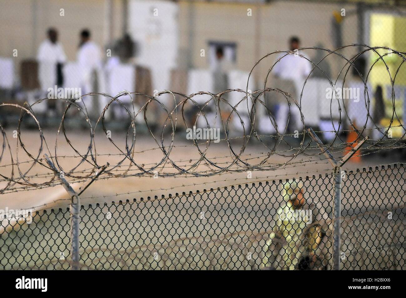 Security guards patrol the prison recreation yard at the Joint Task ...