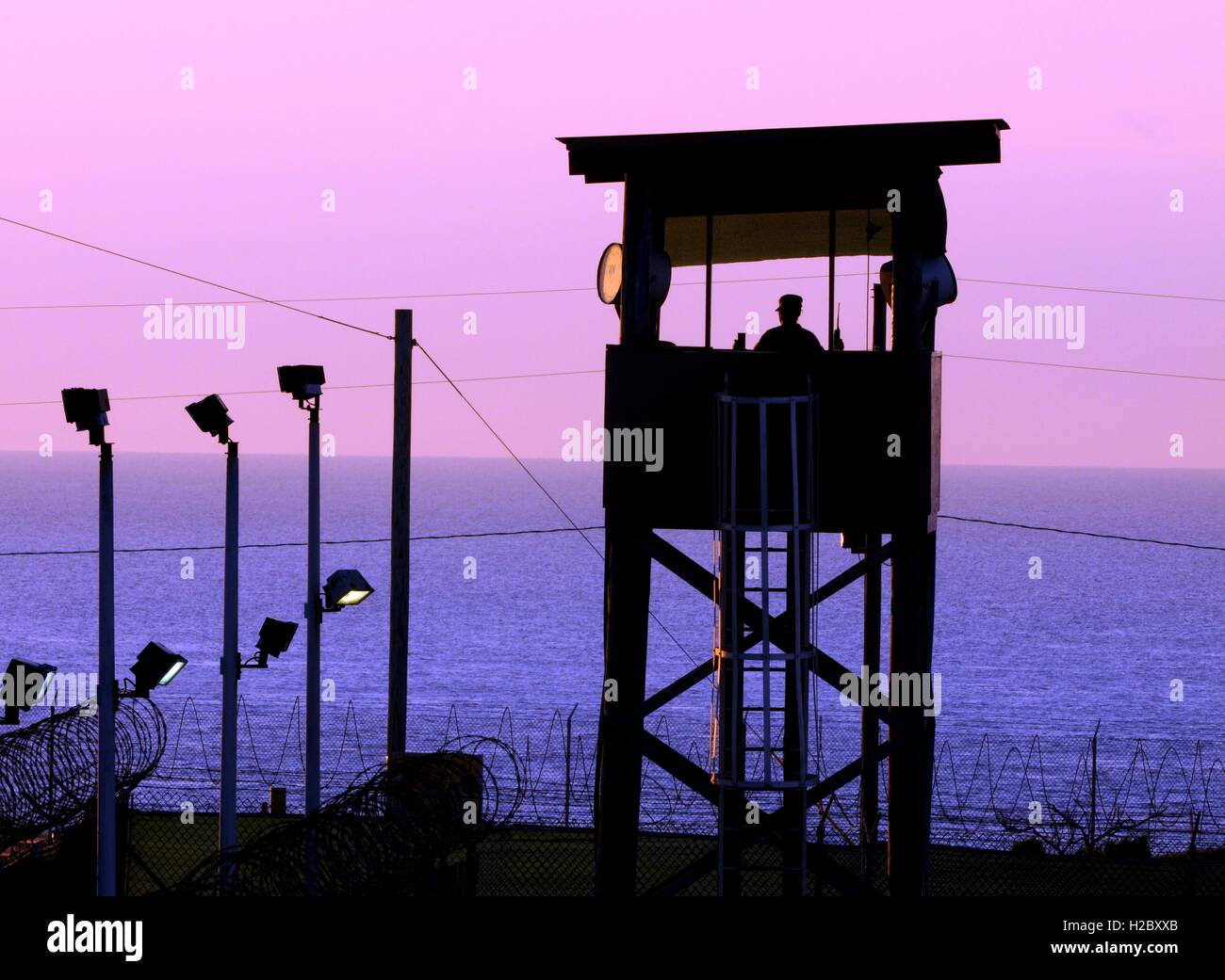 Security guards patrol the prison grounds from guard towers at Joint ...
