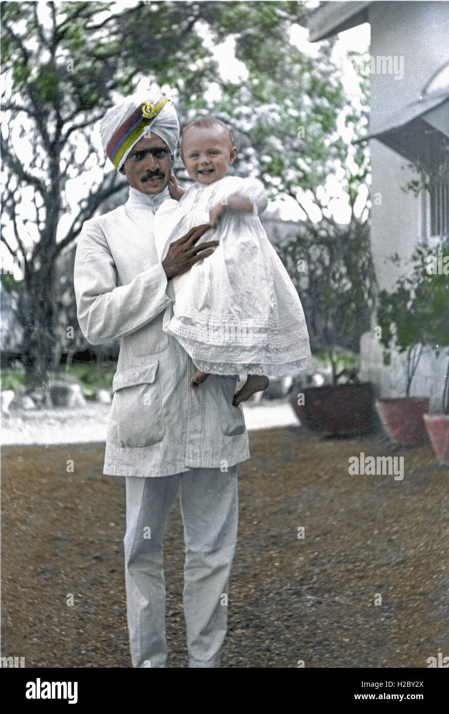 Colourised image showing an RAMC orderly holding Tom Frost, son of Lt ...