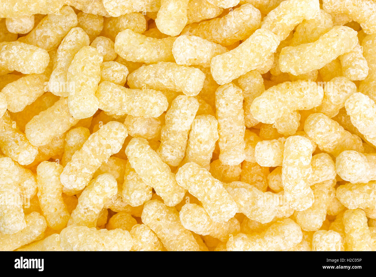 Crunchy corn sticks background Stock Photo - Alamy