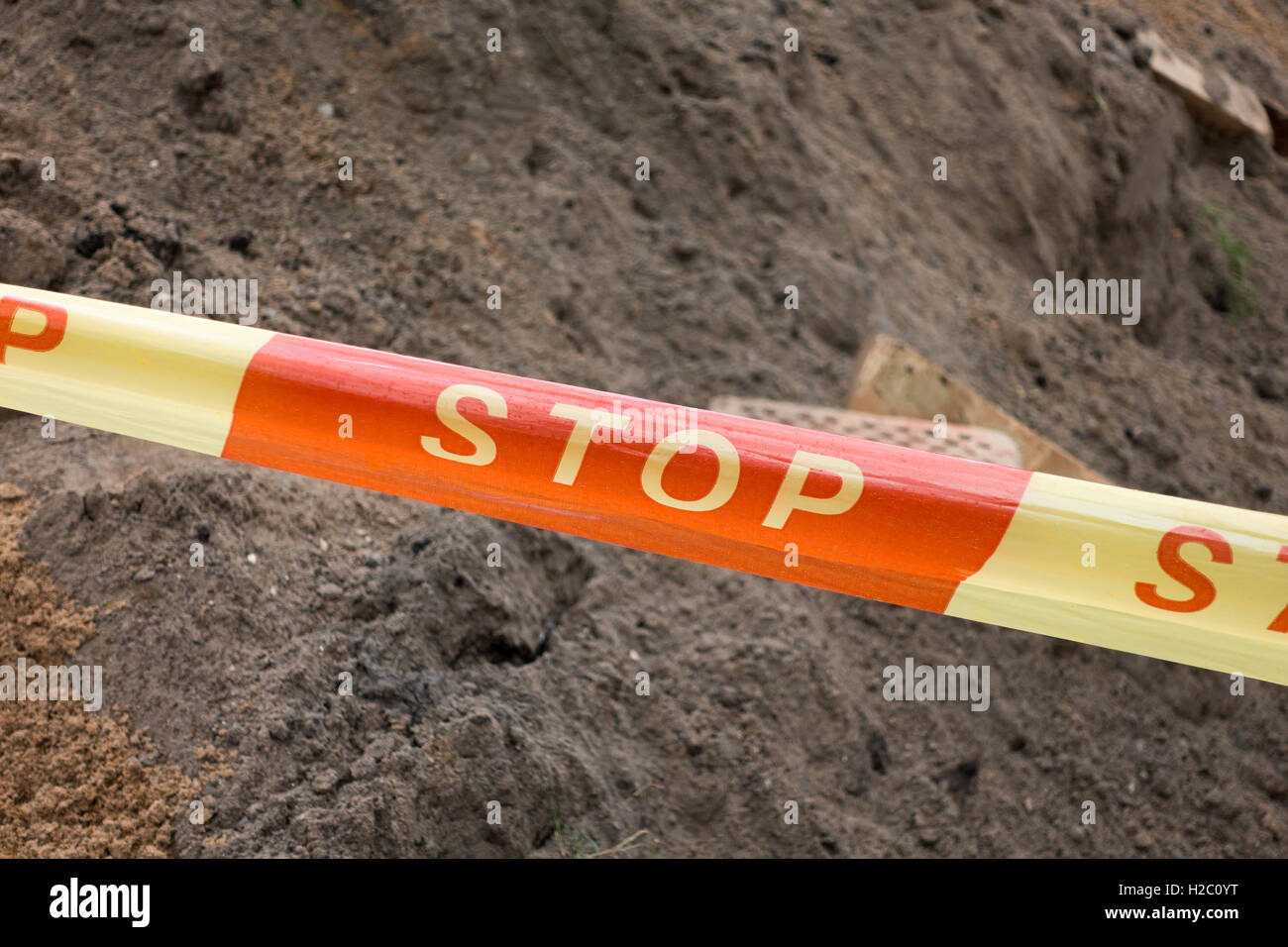stop sign ribbon on the construction site Stock Photo - Alamy