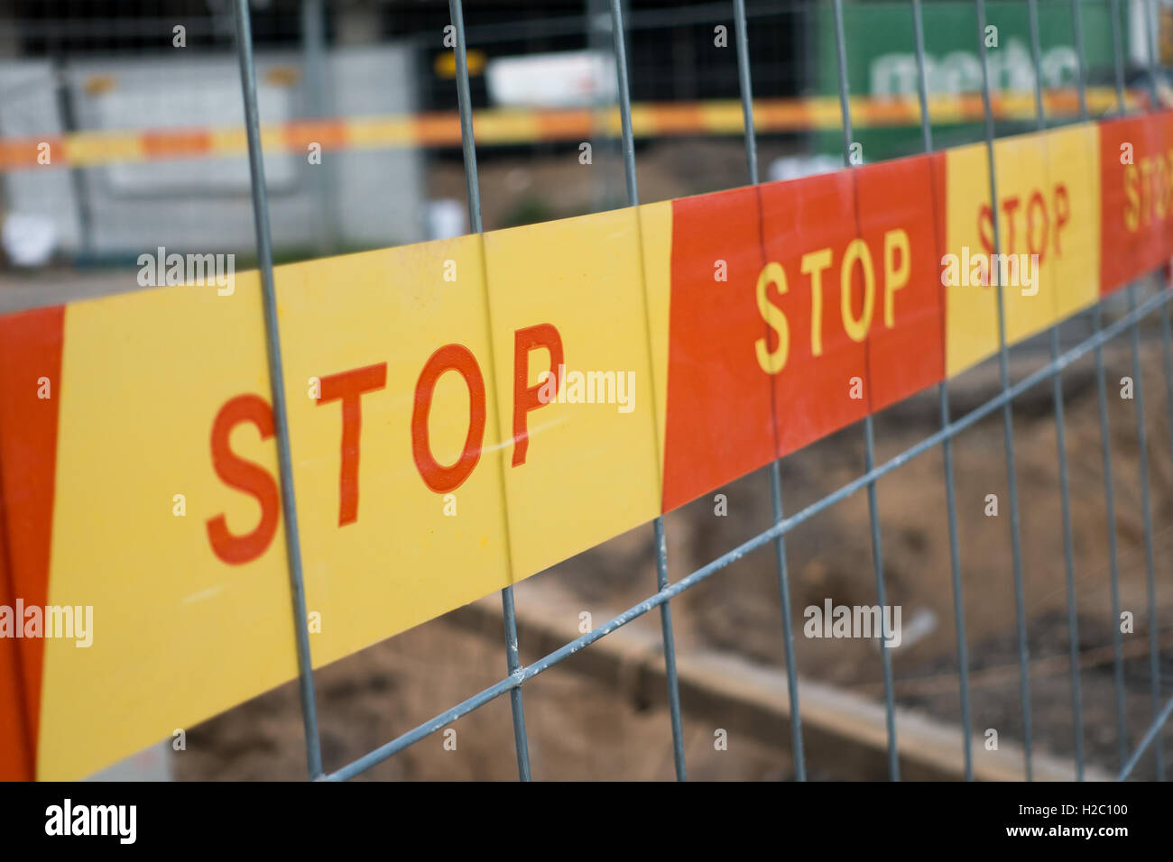 stop sign ribbon on the construction site Stock Photo - Alamy