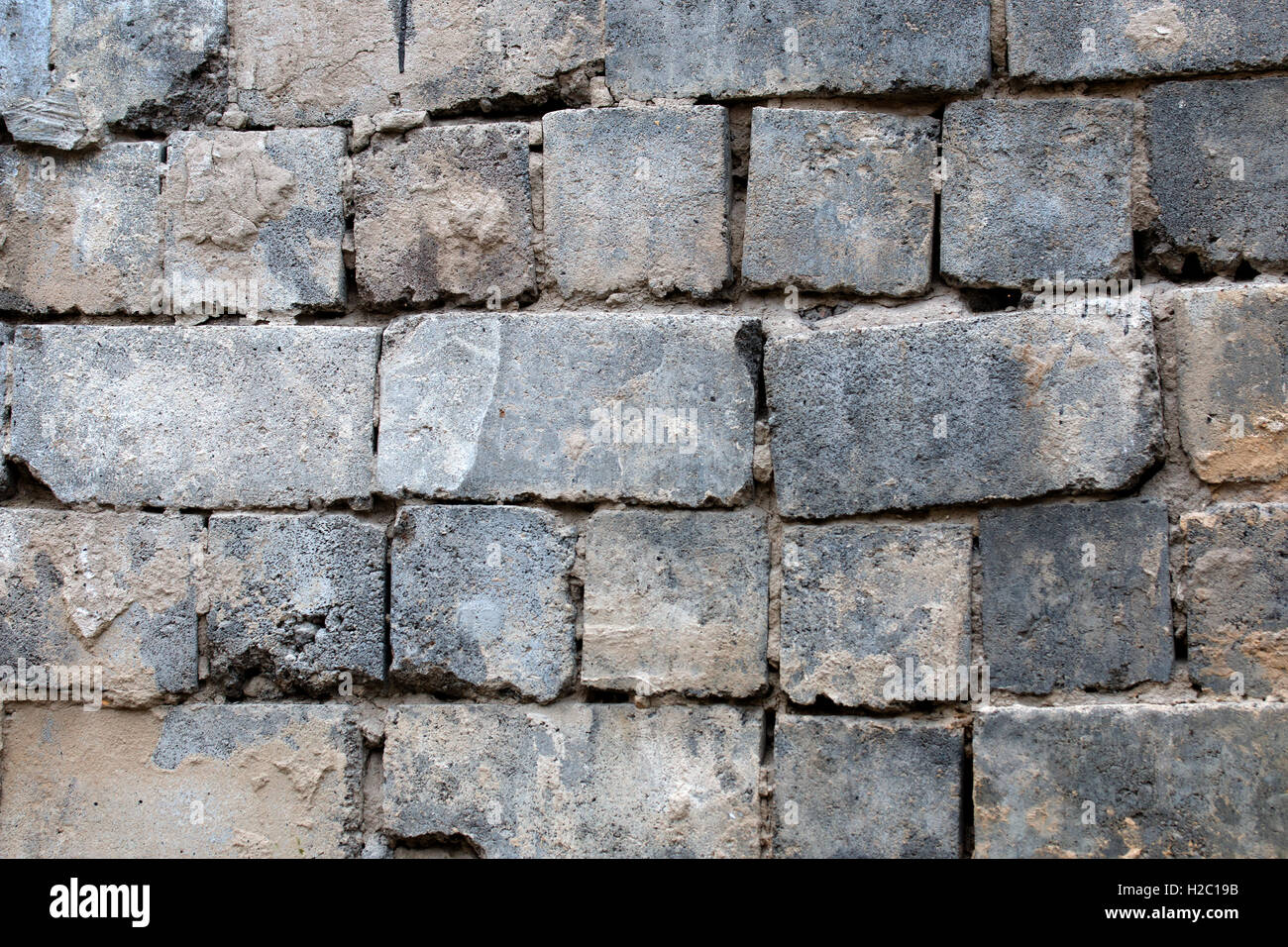 the broken plaster on the wall of bricks Stock Photo - Alamy