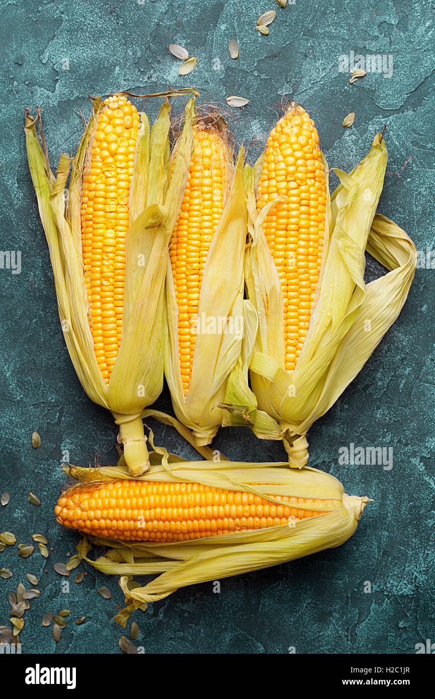Ears of corn on the textural concrete top view Stock Photo - Alamy