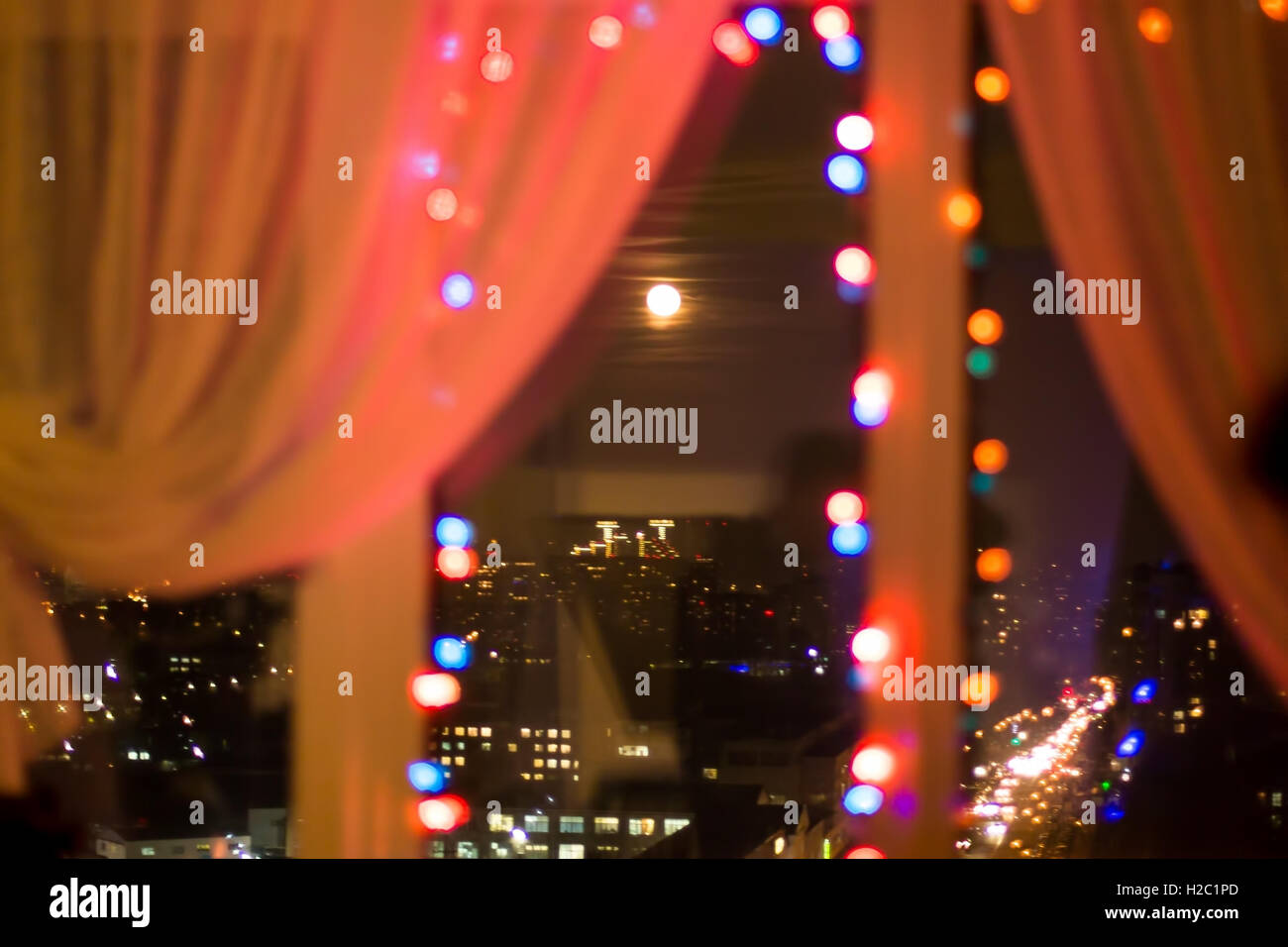Cityscape behind decorated window Stock Photo - Alamy