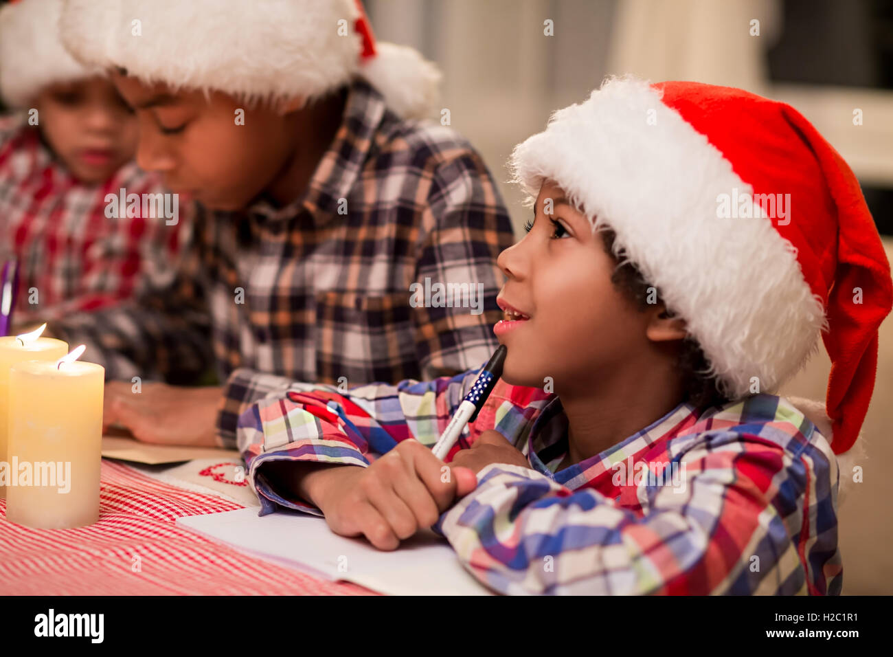 Children writing letter to Santa Stock Photo - Alamy