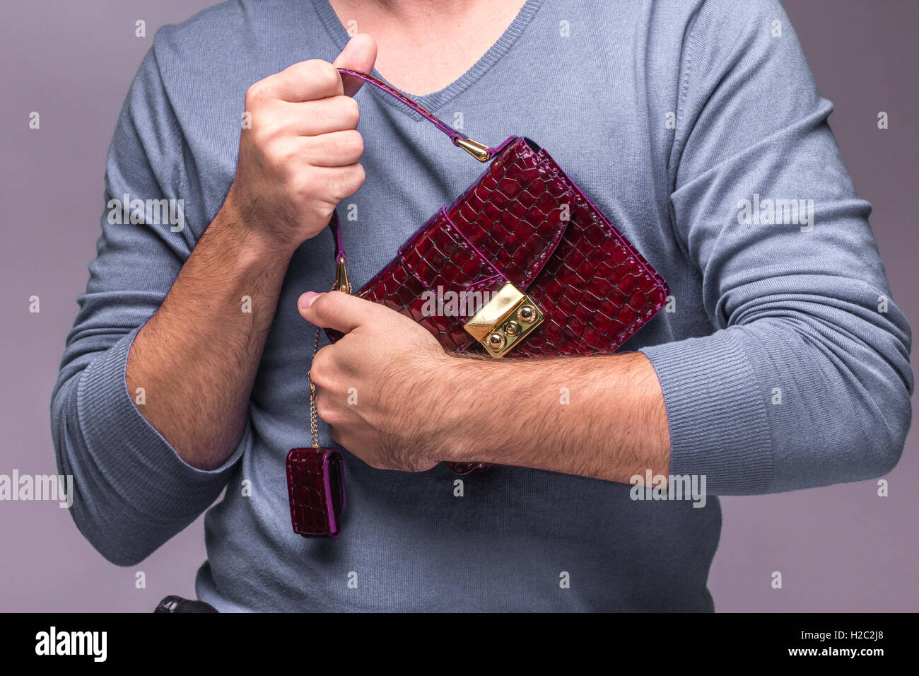 Modern blue bag in male hands Stock Photo - Alamy