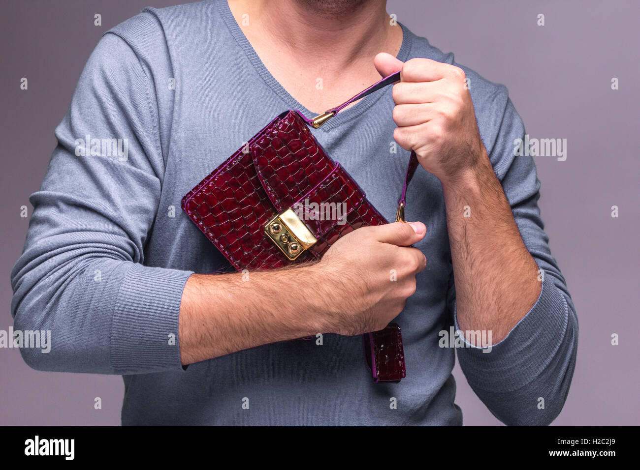 Modern blue bag in male hands Stock Photo - Alamy