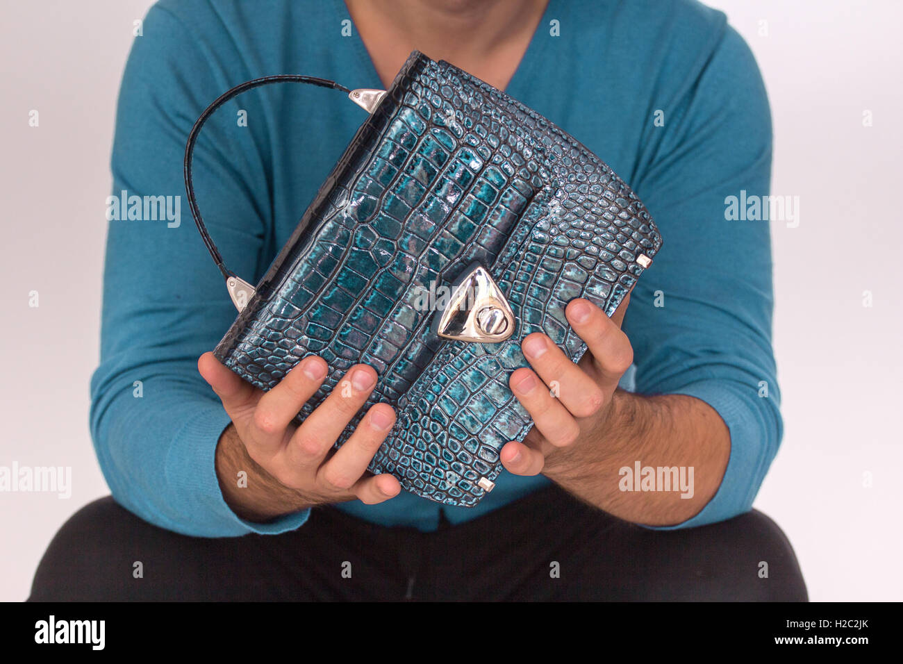Modern blue bag in male hands Stock Photo - Alamy