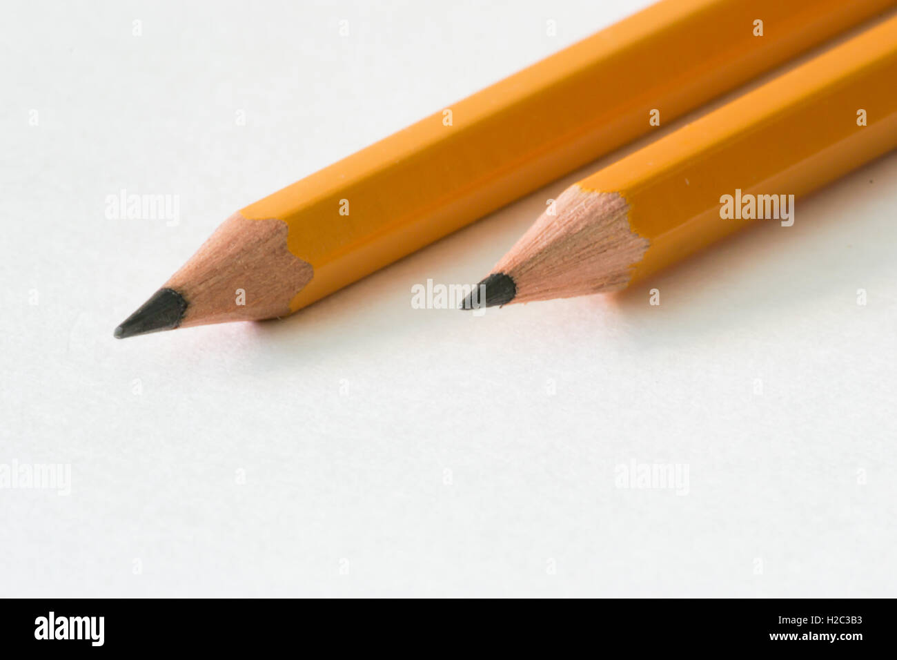 Two yellow pencils on white background. Sharpened Stock Photo - Alamy