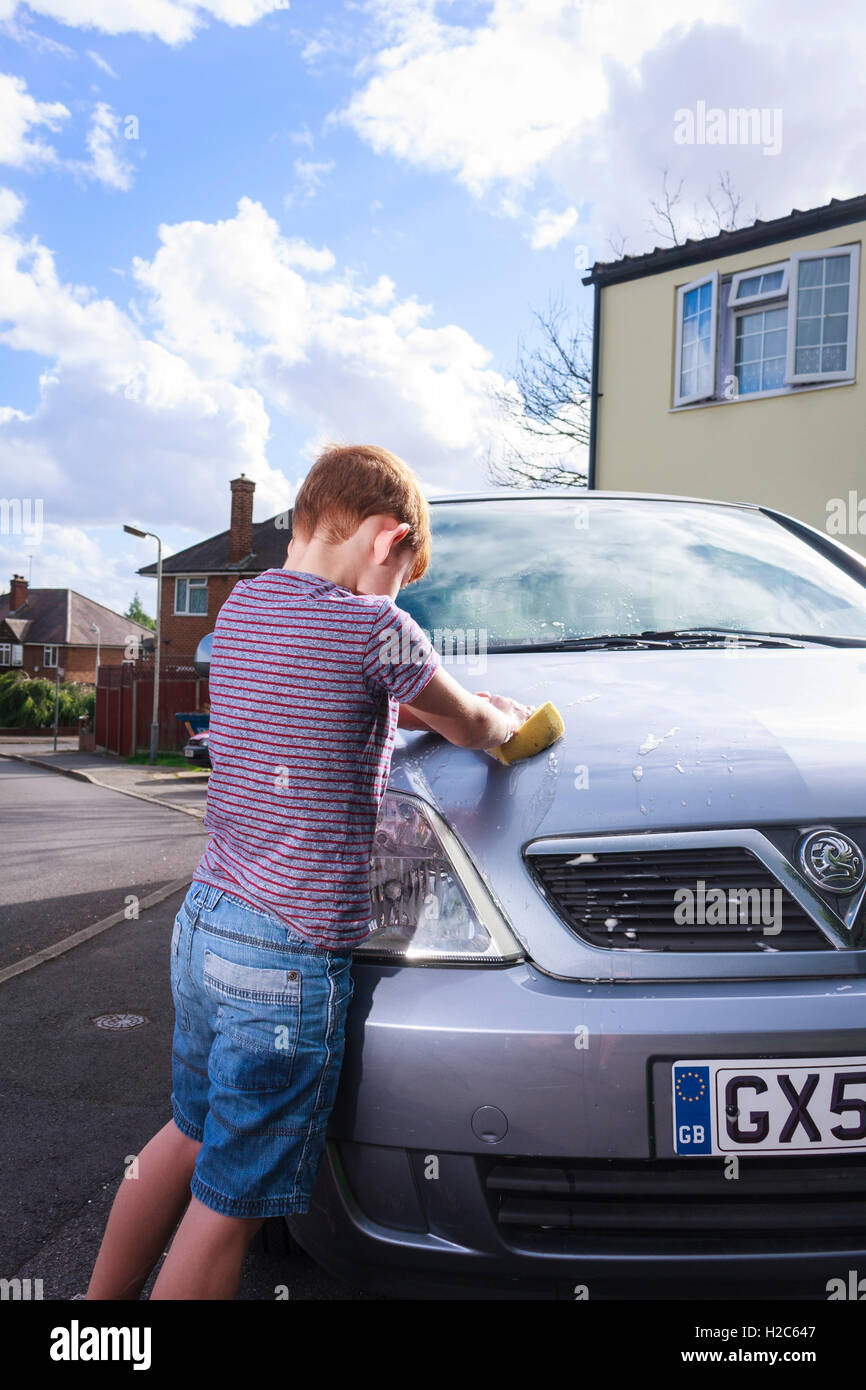 Boy washing car hi-res stock photography and images - Alamy