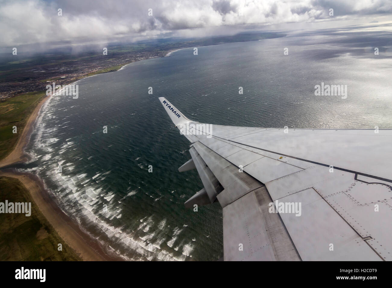 View from a tilted plane taking off his wing with Scotland prestwick ...