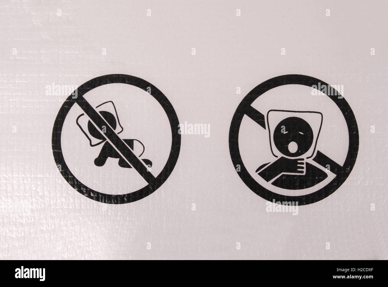 Warning signs on packaging of danger for children Stock Photo - Alamy