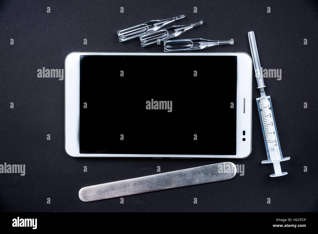 Tablet pc with medical objects on a desk Stock Photo - Alamy