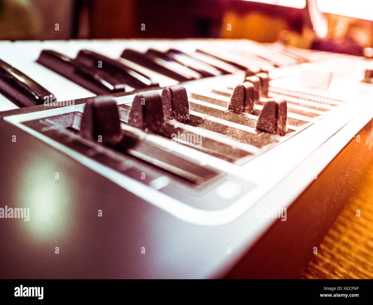 Keyboard of a synthesizer with sliders Stock Photo - Alamy