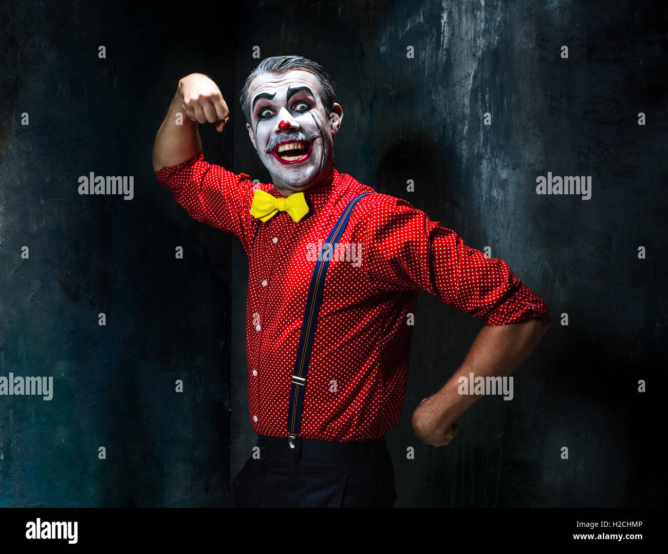 Terrible clown and Halloween theme: Crazy red clown in a shirt with ...