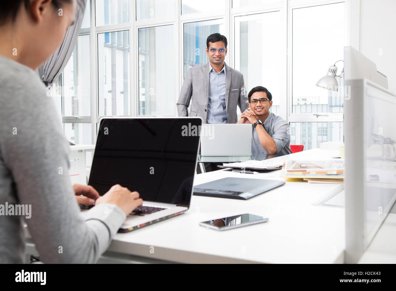 Businessmen with technology in office meeting Stock Photo - Alamy
