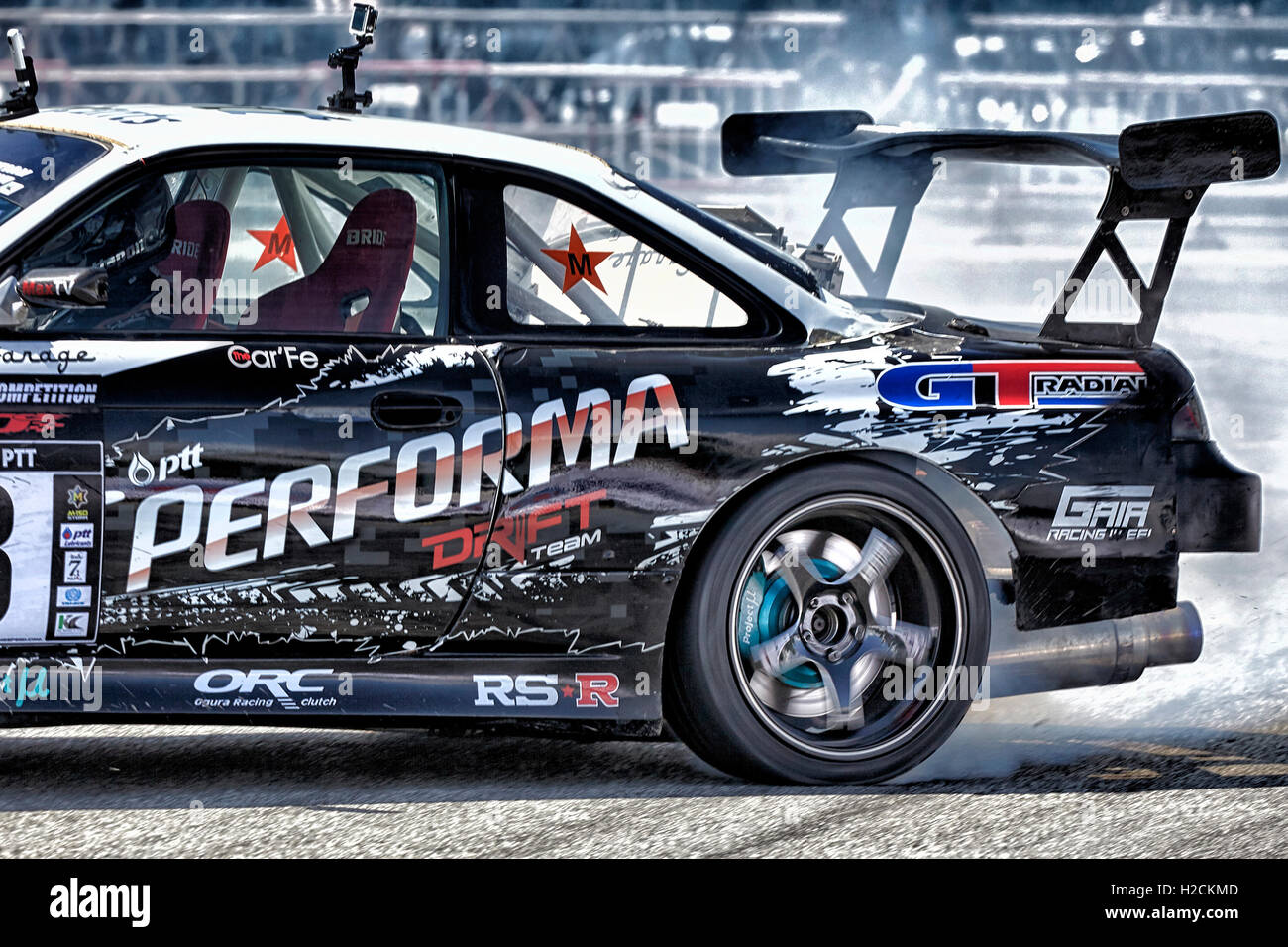 Car drifting auto racing event action with smoking tyres. Pattaya ...