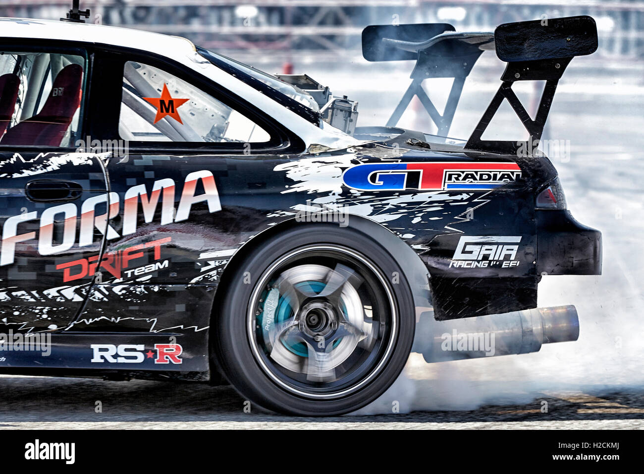 Car drifting auto racing event action with smoking tyres. Pattaya ...