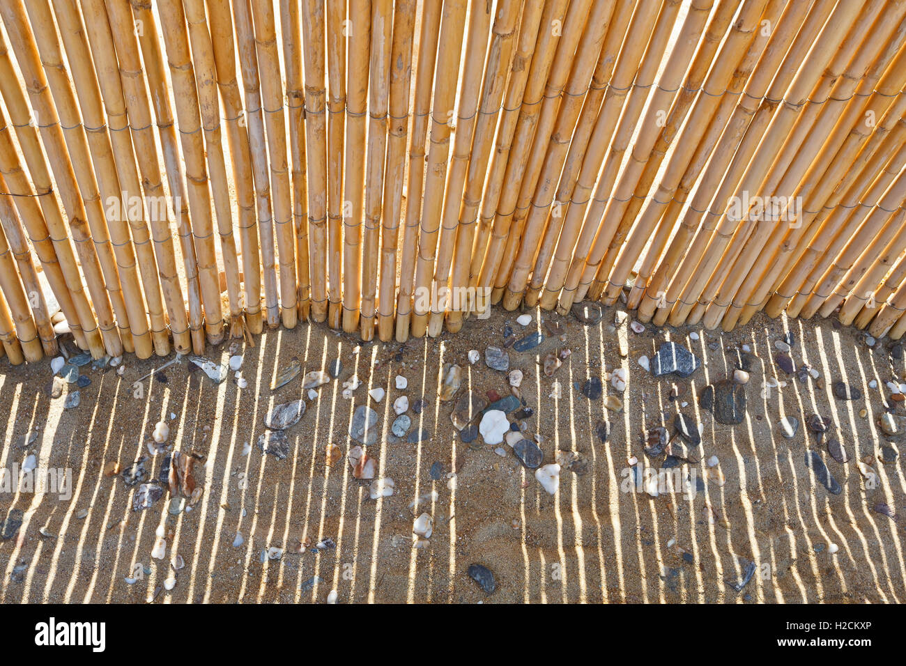 Reed wind barrier standing in the sand on a beach near Gavrio, Greece ...
